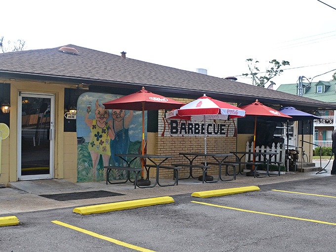 The unassuming exterior of Hot Spot Barbecue proves once again that the best barbecue joints often hide behind modest facades. Those yellow umbrellas practically whisper, "Smoke signals ahead!"