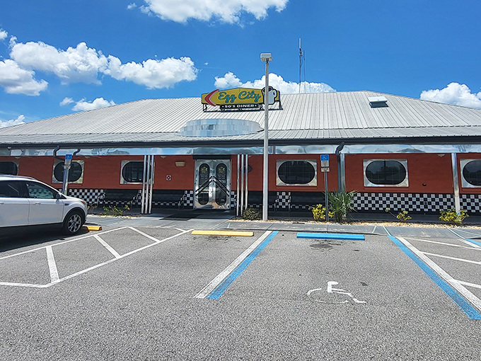 The vibrant orange exterior with its classic checkered trim isn't just eye-catching&mdash;it's a beacon of breakfast hope for hungry travelers on Florida's highways.