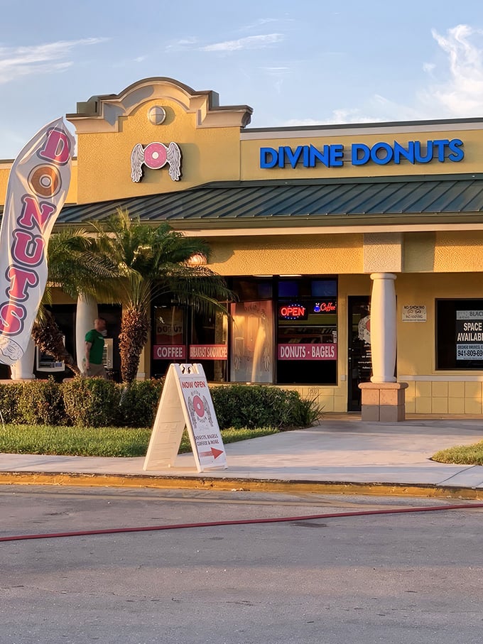 The sunshine-yellow exterior of Divine Donuts stands out like a beacon of hope for the sugar-deprived, complete with their angelic donut logo promising heavenly treats inside.