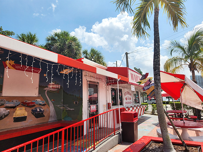 The classic red and white exterior of Wall's beckons like a sweet mirage under swaying palms, promising frozen salvation from Miami's relentless sunshine.
