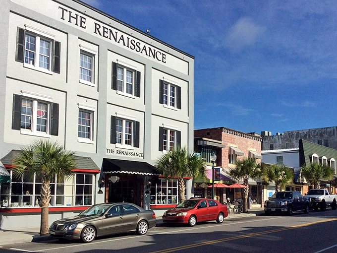Historic brick buildings line Mount Dora's main street, where palm trees and vintage architecture create that perfect "Old Florida meets small-town charm" vibe.