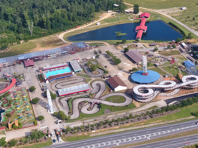 Bird's-eye view of Fun Spot America reveals go-kart tracks, water features, and classic rides nestled in Georgia's landscape &ndash; compact joy personified.