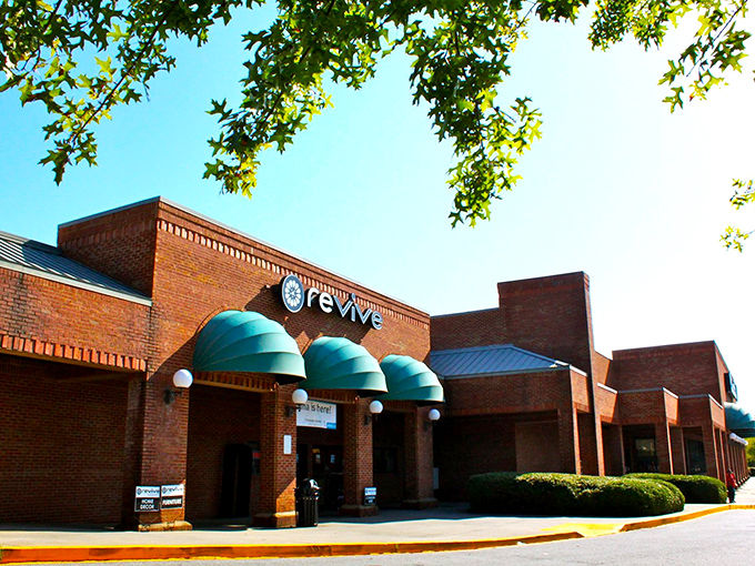 The brick fa&ccedil;ade and teal awnings of Revive Consignment stand like a beacon of bargain-hunting hope in Woodstock, inviting treasure-seekers to step inside and discover.