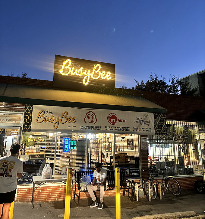 The iconic yellow Busy Bee sign beckons hungry souls like a soul food lighthouse on Atlanta's MLK Drive. History and flavor await inside.