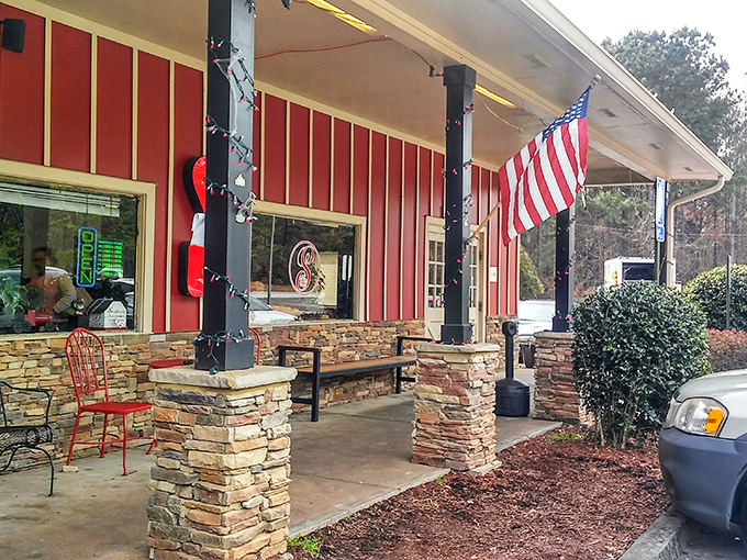 The classic American diner dream lives at Sister's Family Restaurant, where vintage muscle cars in the parking lot hint at the timeless treasures waiting inside.