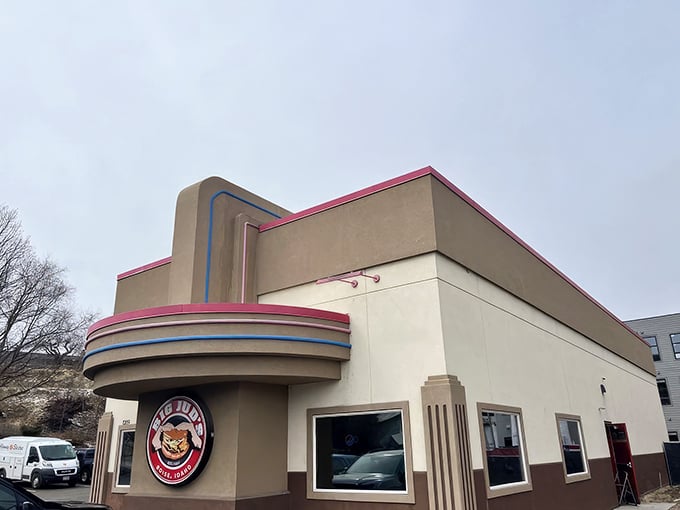 Big Jud's Art Deco-inspired exterior stands like a time machine to burger paradise, complete with that iconic pink trim that says "serious comfort food inside."