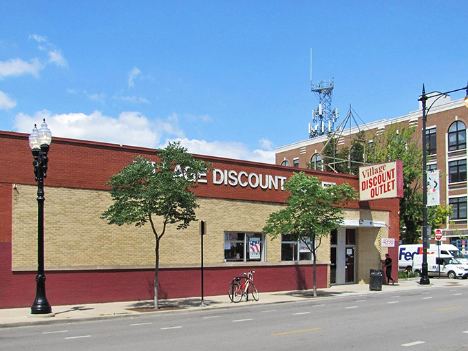 The unassuming brick facade of Village Discount Outlet on Clark Street - Chicago's Narnia wardrobe for bargain hunters seeking retail adventure.