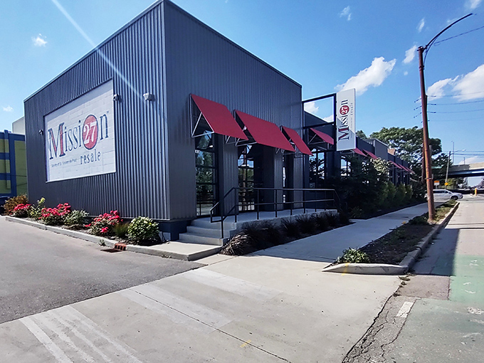 Mission 27's modern exterior with its distinctive red awnings stands as a stylish contradiction to the "thrift store" stereotype. Upscale bargain hunting begins here.