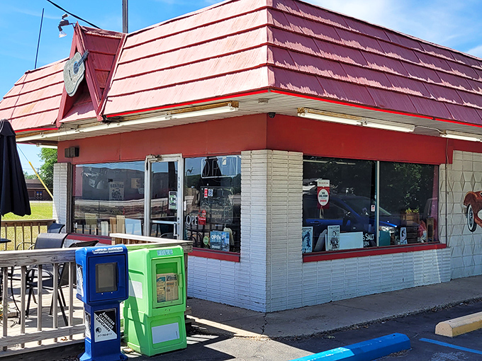 The classic red-roofed exterior of Rock-Cola 50's Cafe promises a time warp before you even step inside. That vintage Corvette mural isn't just decoration&mdash;it's a preview of coming attractions.