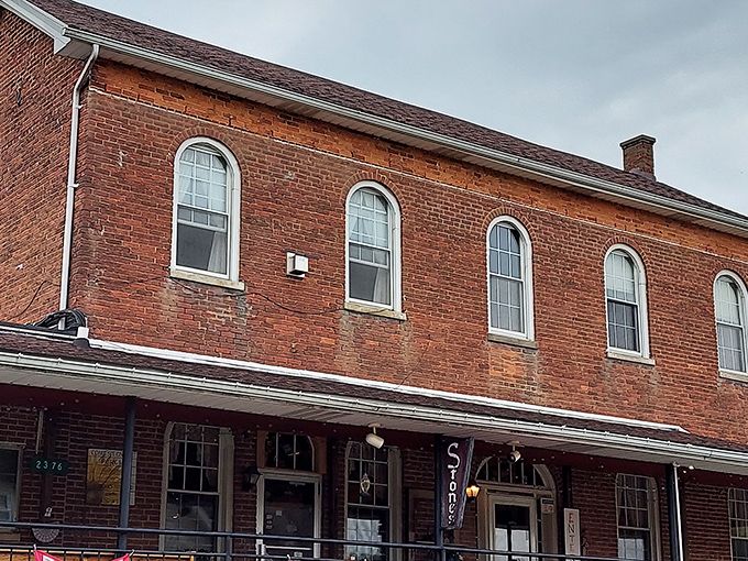 The historic brick building housing Stone's Family Restaurant stands proudly in Millhousen, its wraparound porch inviting hungry travelers to step back in time.