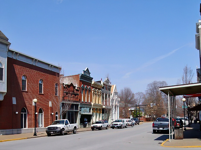 Historic charm meets small-town serenity on New Harmony's Main Street, where brick buildings whisper stories of utopian dreams and antique treasures await.