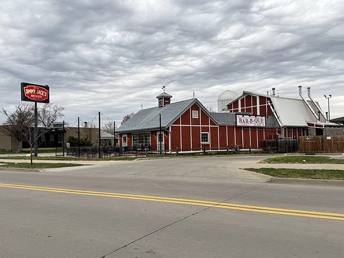 The red barn-like structure with its silo isn't just architectural flair&mdash;it's a beacon calling hungry travelers home to barbecue paradise.