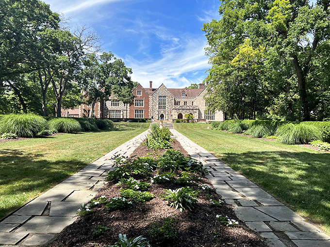 The fa&ccedil;ade of Salisbury House combines red brick and flint-speckled limestone in a Tudor masterpiece that makes Iowa feel decidedly more Downton Abbey than downtown Des Moines.