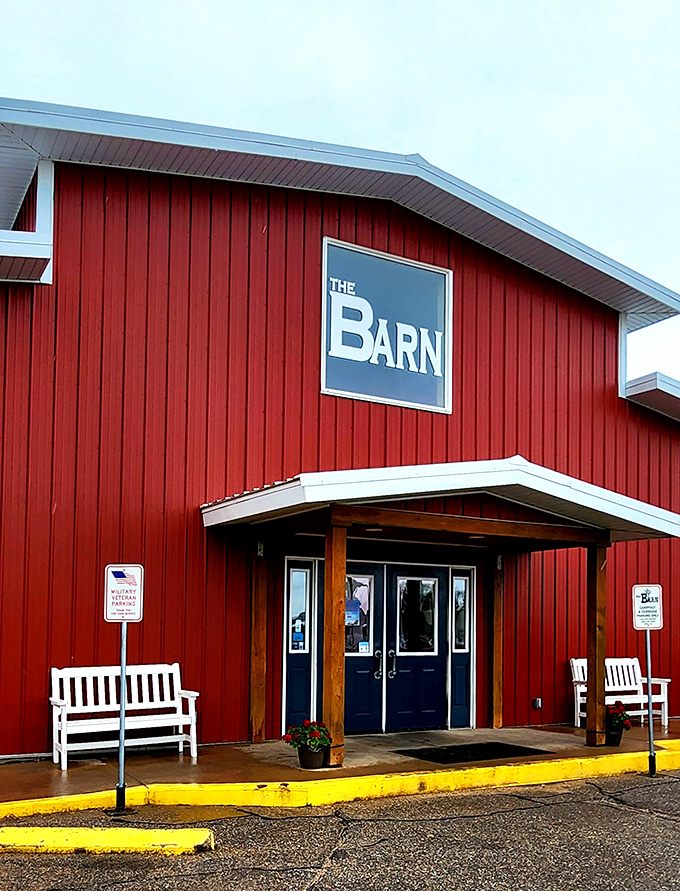 The bright red exterior of The Barn stands out against the Kansas sky like a beacon for hungry travelers. No fancy frills, just the promise of honest-to-goodness comfort food inside.