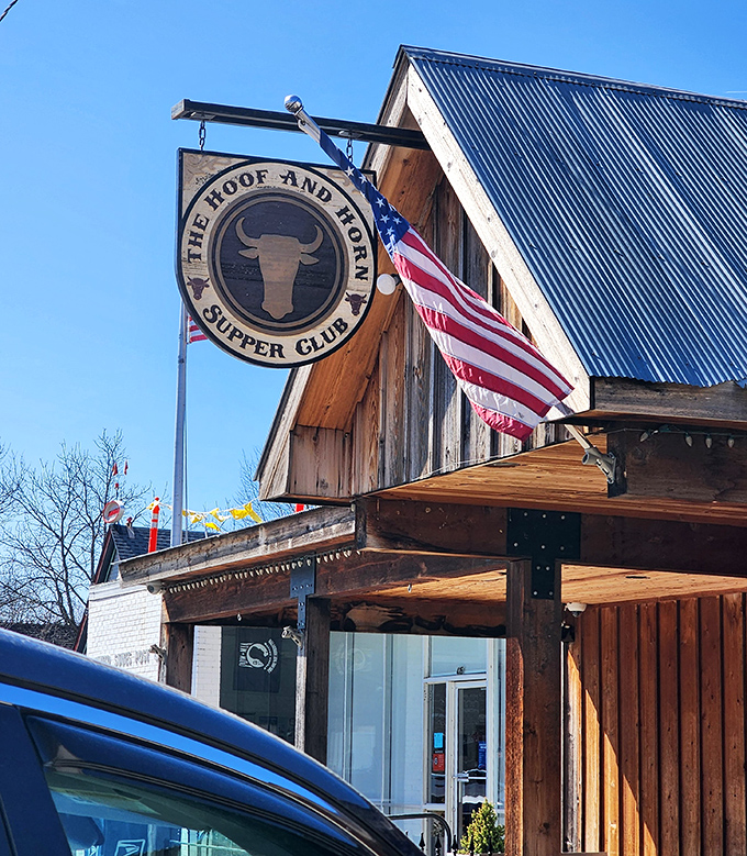 The rustic wooden exterior of The Hoof & Horn beckons like a frontier outpost for hungry travelers. Those swinging doors promise carnivorous delights within.