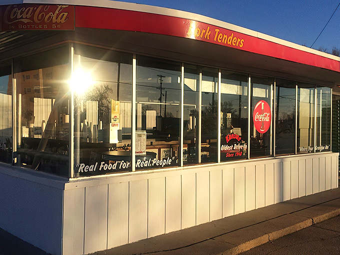 The iconic white building with red trim has been a Hutchinson landmark since 1948. The "Hamburgers" sign promises nostalgic delights within.