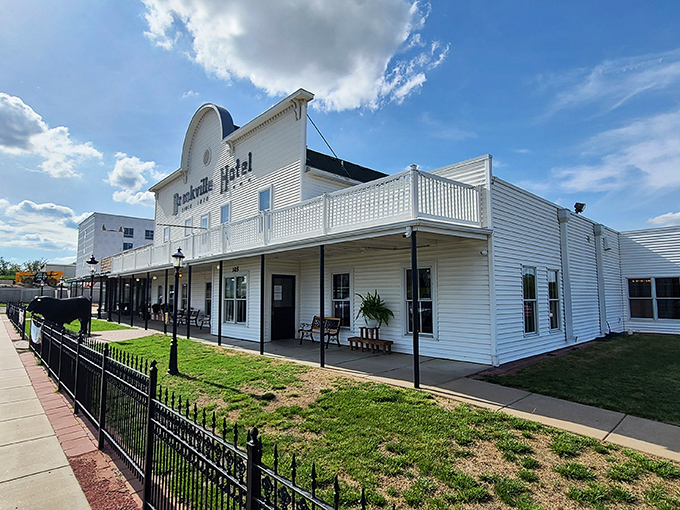 The iconic white facade of Brookville Hotel stands proudly against the Kansas sky, a beacon for fried chicken pilgrims from across the Midwest.