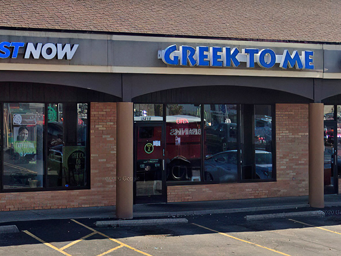 The bright blue sign beckons like a Mediterranean lighthouse in a sea of strip mall sameness. Kentucky's answer to Athens awaits inside.