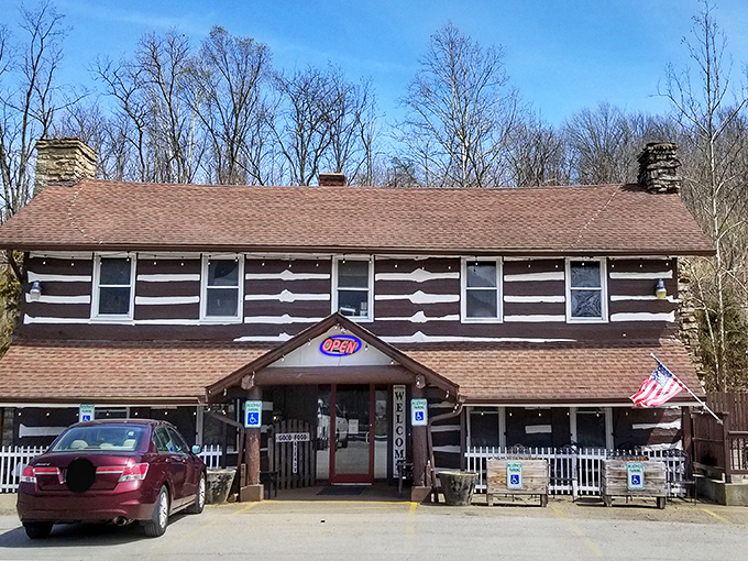 The iconic Log Cabin Inn exterior showcases authentic cabin architecture with its distinctive brown and white pattern&mdash;Kentucky comfort food headquarters in architectural form. 