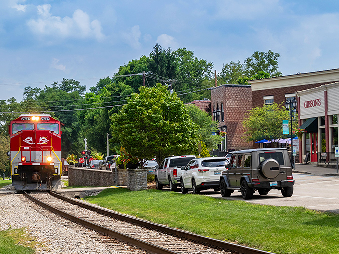 The quintessential small-town moment: a bright red locomotive rumbling past historic storefronts. Midway's railroad heritage isn't just preserved&mdash;it's still very much alive!