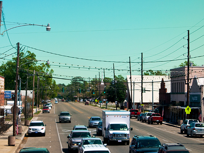 Paul's Caf&eacute; anchors the corner of Ponchatoula's historic downtown, where string lights create an everyday celebration atmosphere along brick-paved streets.