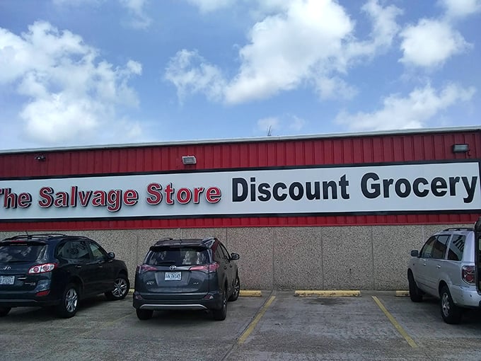 The bright red exterior of The Salvage Store stands out like a beacon for bargain hunters, promising treasure inside those unassuming walls.