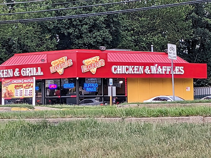 The neon-trimmed exterior of Legends Chicken & Grill glows like a beacon for fried chicken pilgrims, promising salvation from ordinary meals in strip mall heaven.
