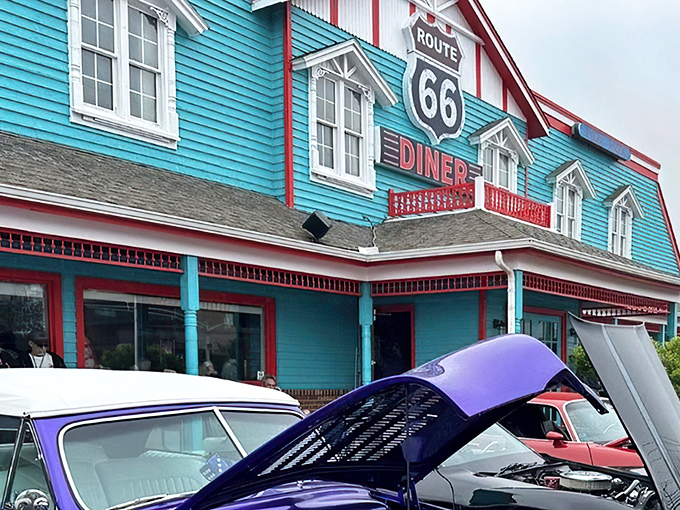 The turquoise beacon of Route 66 Diner stands out against the Maryland sky like a time portal to the 1950s, beckoning hungry travelers with its nostalgic charm.