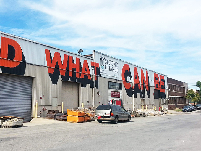 The warehouse with "WHAT" emblazoned across it isn't asking a question&mdash;it's making a statement about possibility and transformation.