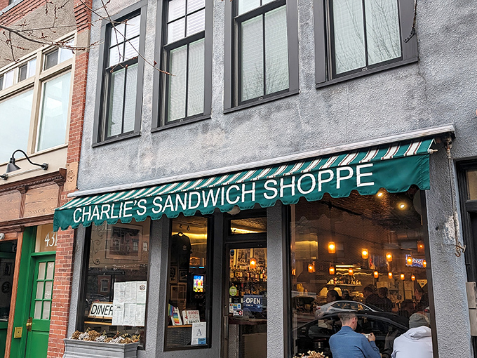 Find your favorite spot under the green awning and enjoy a classic meal while watching the world go by today.