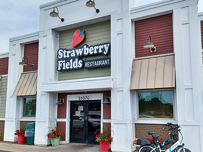 The white facade with its cheerful strawberry logo promises comfort food with a side of Beatles nostalgia. A culinary Yellow Submarine awaits!