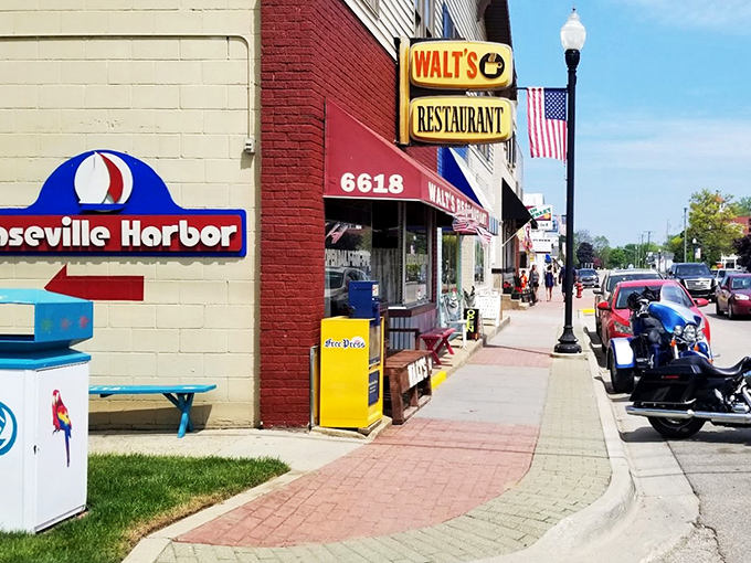The unassuming yellow brick exterior of Walt's Restaurant stands as a beacon of breakfast hope on Caseville's main street, promising comfort food and local charm.