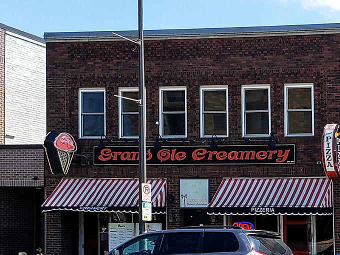The iconic brick fa&ccedil;ade of Grand Ole Creamery, with its vintage striped awnings and neon ice cream cone sign, beckons sweet-toothed pilgrims from across Minnesota.