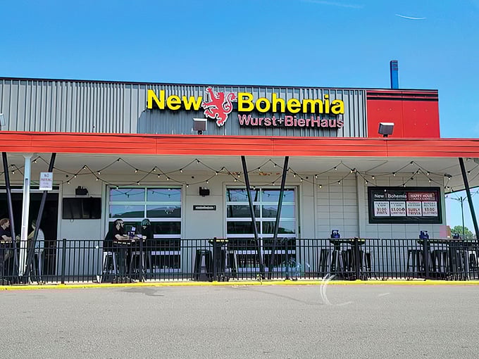 The golden lion on New Bohemia's sign stands guard like a medieval sentinel, promising Bavarian delights within those red-trimmed walls.