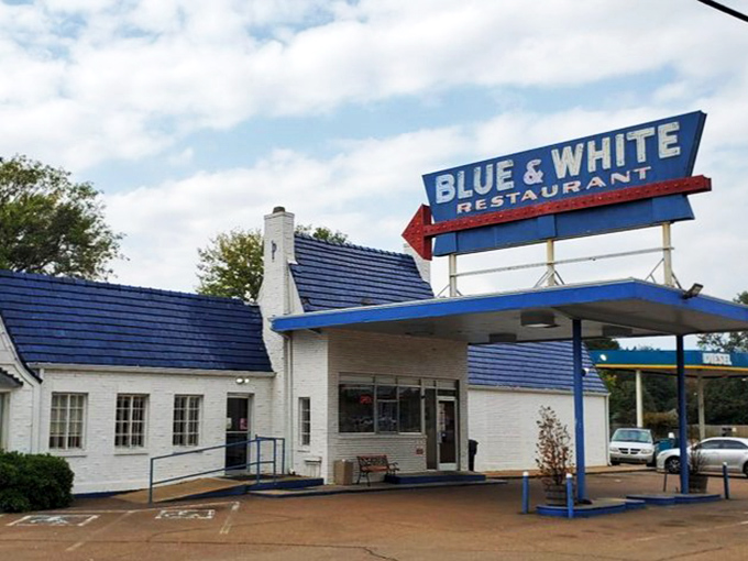 The iconic Blue & White sign beckons hungry travelers like a neon lighthouse on Highway 61. This classic roadside architecture promises comfort food and Mississippi hospitality.