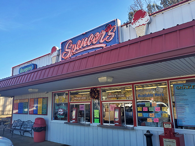 The classic red and white exterior of Spencer's Dairy Kream stands as a beacon of sweet nostalgia in Grenada, promising frozen delights that have stood the test of time.