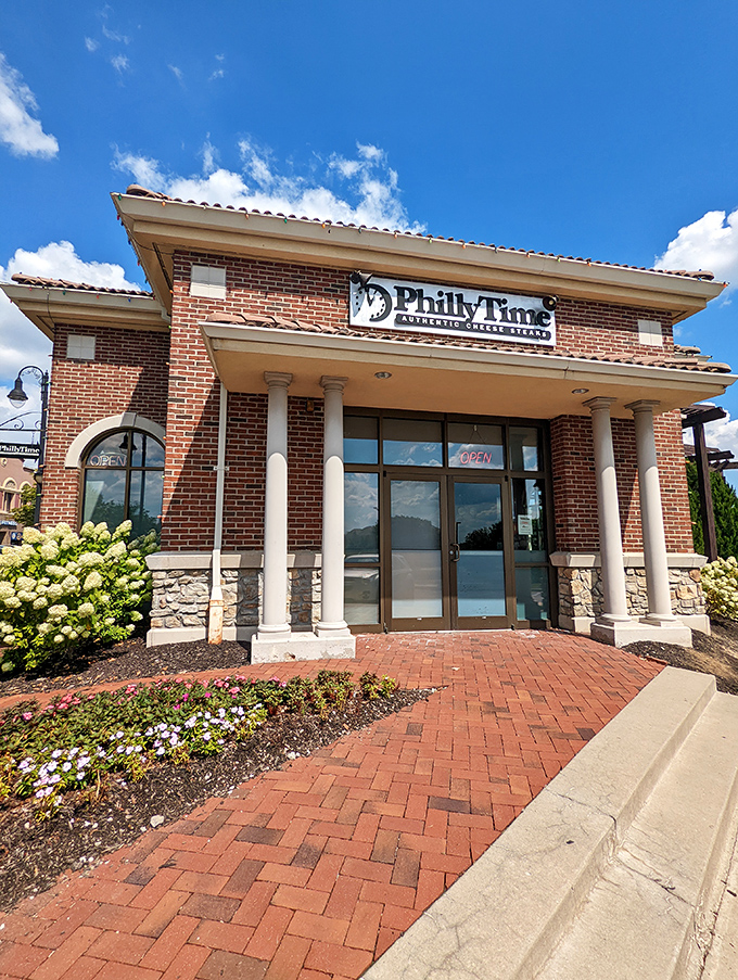 The stately brick exterior of Philly Time stands like a temple to sandwich perfection, complete with columns that say "We take our cheesesteaks seriously."