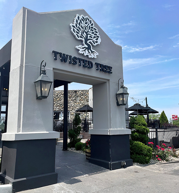 The welcoming facade of Twisted Tree Steakhouse stands proudly against the blue Missouri sky, lantern lights ready to guide hungry pilgrims to beef paradise. 