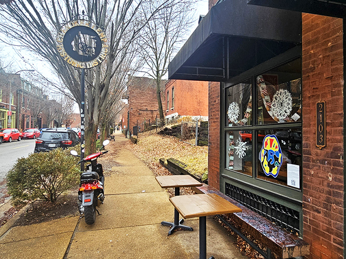 The corner brick building stands like a caffeinated sentinel on Cherokee Street, its classic St. Louis architecture promising refuge for coffee pilgrims.