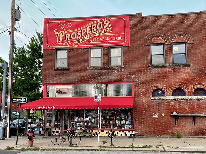 The iconic red and gold sign of Prospero's Books beckons bibliophiles like a literary lighthouse on 39th Street. Books, media, and endless possibilities await.