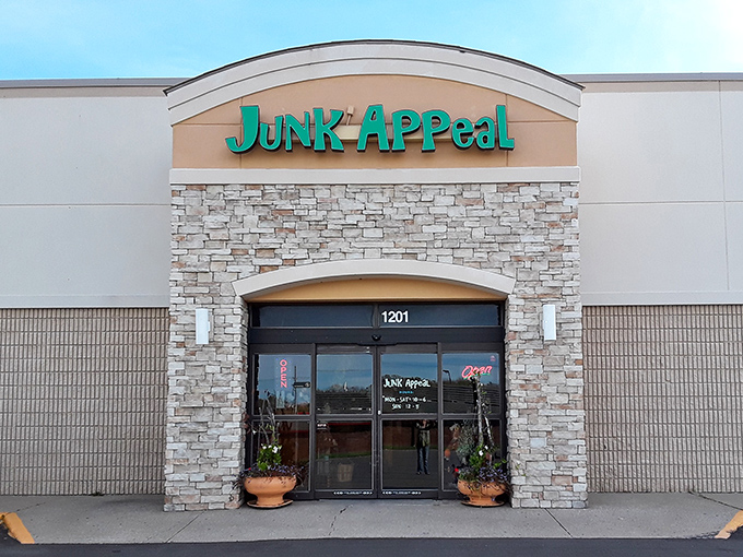 The turquoise sign of Junk Appeal beckons like a siren call to bargain hunters. Behind that stone facade lies a wonderland of treasures waiting to be discovered.