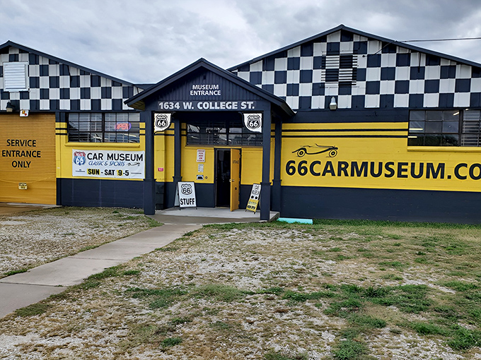 The checkered-flag exterior of Route 66 Car Museum practically screams "START YOUR ENGINES!" – a roadside beacon for automotive enthusiasts in Springfield.