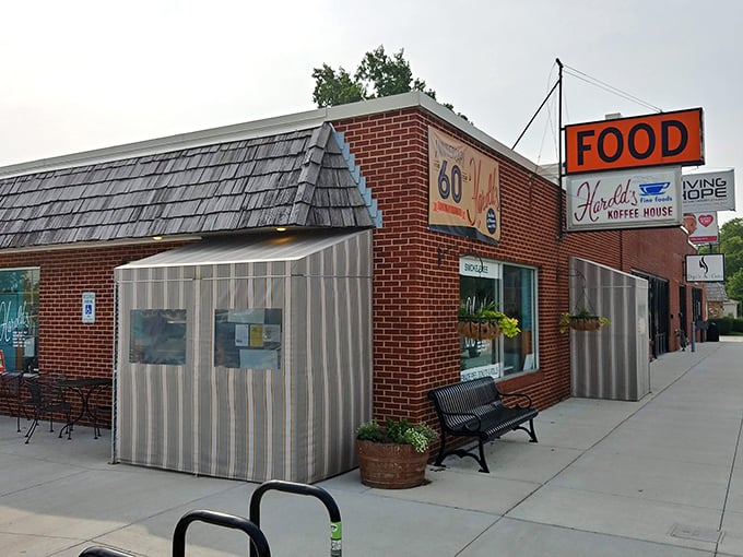 The iconic orange "FOOD" sign has been guiding hungry Nebraskans to Harold's Koffee House for generations, a beacon of comfort in Florence's historic district.