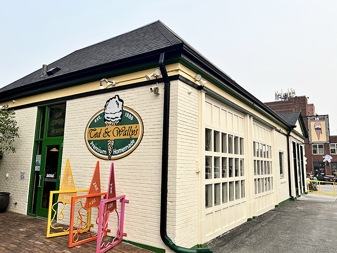 The charming white brick exterior of Ted & Wally's stands as a beacon of sweet promises in Omaha's Old Market district, complete with colorful ice cream cone decorations. 