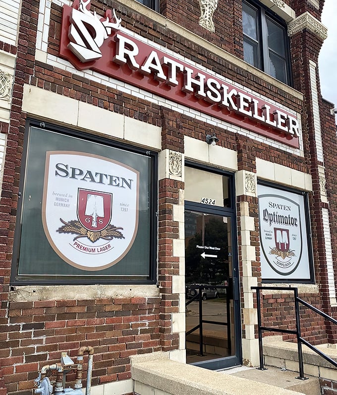 The brick exterior of Rathskeller Bier Haus stands proudly in Omaha, complete with Bavarian blue and white flags fluttering in the Nebraska breeze.