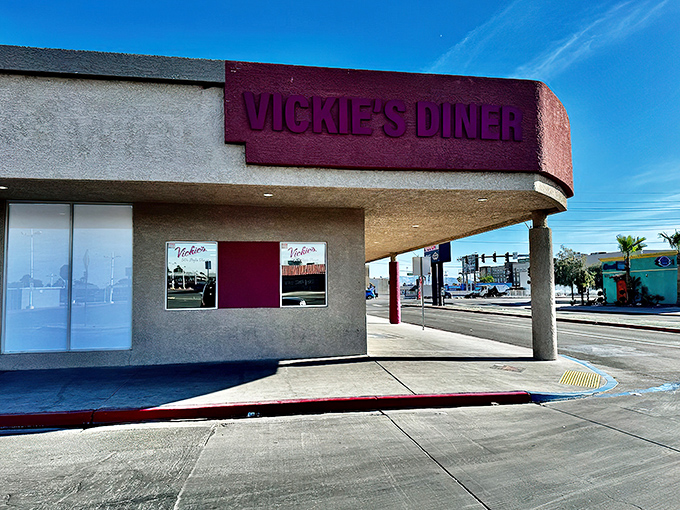 The unassuming exterior of Vickie's Diner stands as a pink-signed beacon of hope for hungry souls seeking refuge from Vegas glitz.