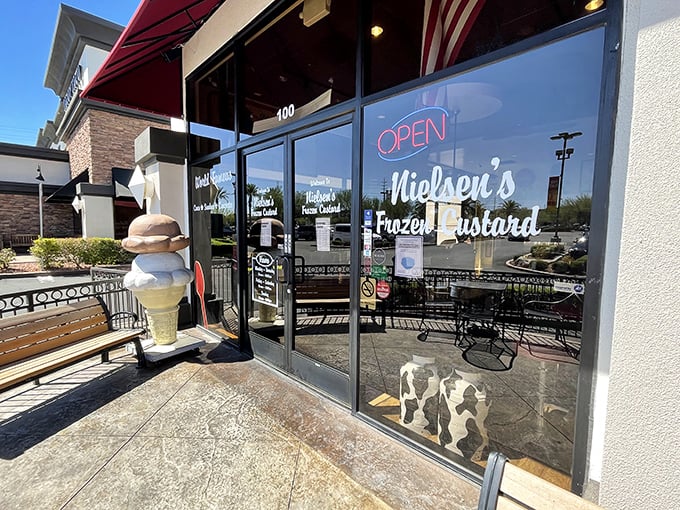 Welcome to frozen custard nirvana! Nielsen's storefront beckons with retro charm and a giant ice cream cone sculpture that's practically winking at you.