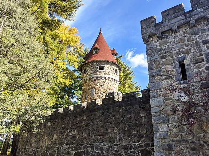 The grand entrance to Searles Castle looks like the perfect setting for a medieval fantasy film, complete with stone turrets and battlements nestled among New Hampshire pines.