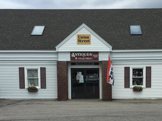 The unassuming exterior of Union Street Antiques beckons with its yellow sign and classic New England charm&mdash;a time portal disguised as a simple white building.