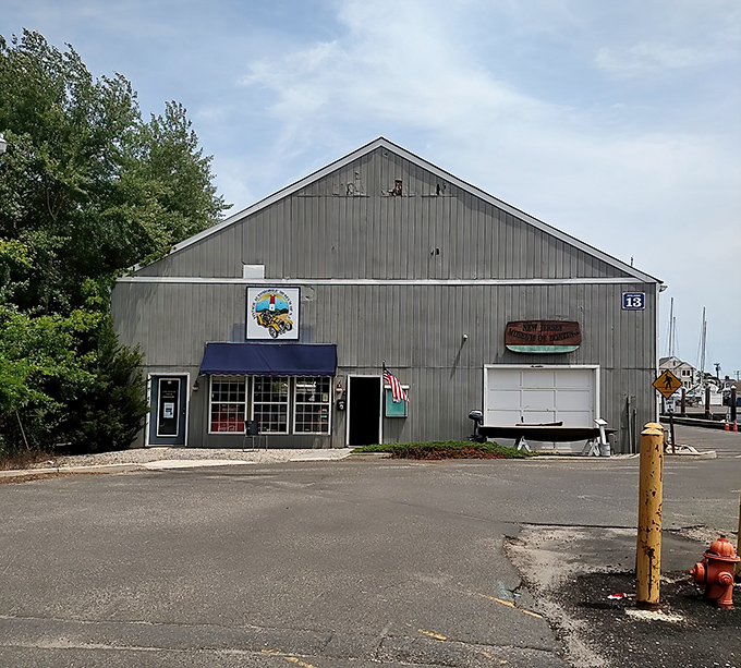 The unassuming gray exterior hides automotive treasures like your grandmother's secret recipe box—except instead of cookies, you'll find Cadillacs.